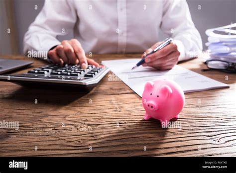 Businessperson Calculating Bill Stock Photo Alamy