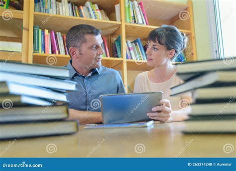 Man And Woman Sitting At Table In Library Stock Photo Image Of Library Happy