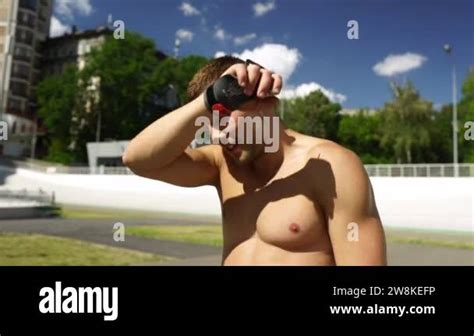 Muscular Guy With A Naked Torso Wipes The Sweat Off Your Face Stock