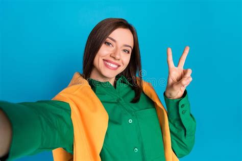 Photo Of Pretty Positive Person Make Selfie Demonstrate V Sign Isolated