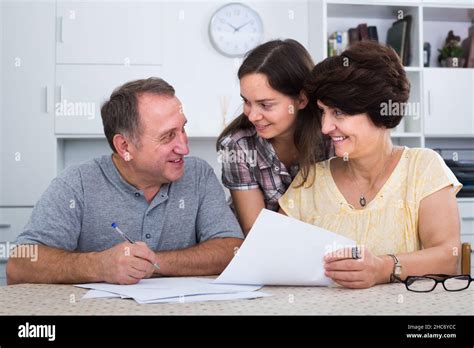 Senior Couple Signing Documents Hi Res Stock Photography And Images Alamy