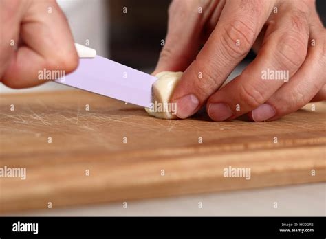 Slicing Garlic Making Chicken Cheese And Leek Parcel Series Stock