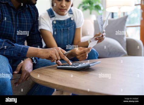 Indian Married Couple Calculating Bills Discussing Planning Budget Together Serious Wife And