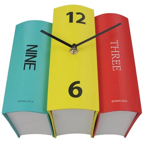 A Clock Made Out Of Three Books With Numbers On Each Side And The