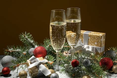 Premium Photo Champagne Glasses And Baubles Against Golden Space
