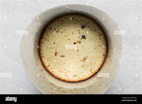 Overhead View Of Layered Cake Being Filled With Chocolate Ganache Top