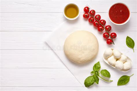 Raw Pizza Dough With Baking Recipe Ingredients Mozzarella Tomatoes