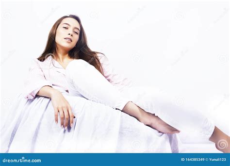 Young Pretty Brunette Woman In Bed Covered White Sheets Smiling