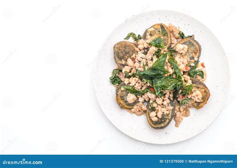 Stir Fried Century Egg And Minced Pork With Holy Basil Leaves Stock