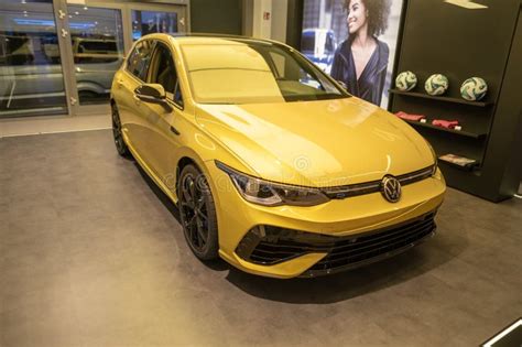 Sleek Yellow Vw Golf R Sports Car Parked In Showroom High Performance