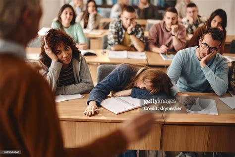 Bored High School Students Attending A Class In The Classroom High Res