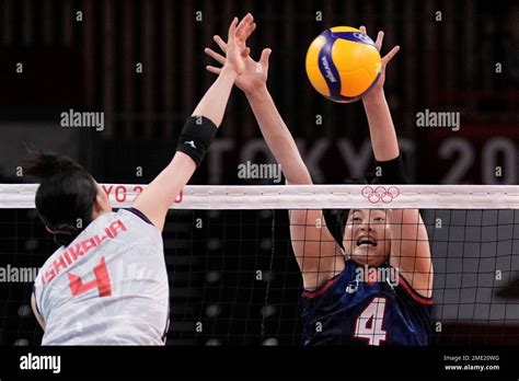 South Koreas Kim Hee Jin Tries To Block A Spike From Japans Mayu