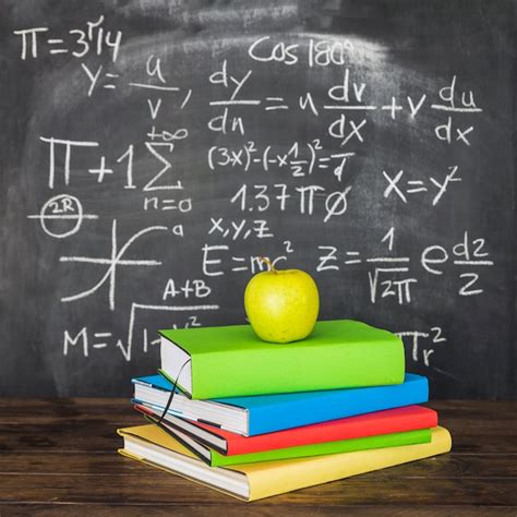Premium Photo Workplace With Books And Apple Near Chalkboard