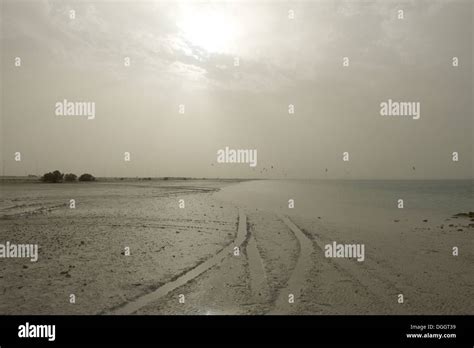 Sudden Sandstorm Developing Over Beach Blotting Out Sun And Catching
