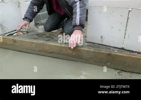 Concreting Of Reinforced Concrete Floor Worker Concretes Floor Pour Cement Mortar On