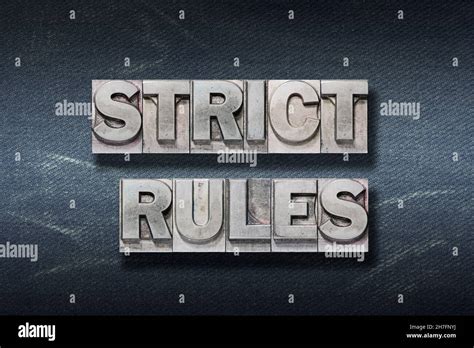 Strict Rules Phrase Made From Metallic Letterpress On Dark Jeans