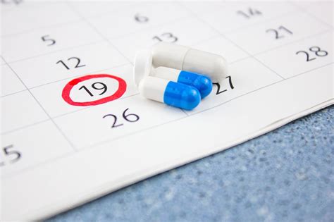 Premium Photo Monitoring The Intake Of Medications Medicines Pills And A Calendar Schedule Of