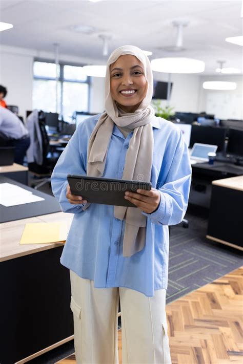 Vertical Image Of Happy Middle Eastern Businesswoman In Hijab Looking