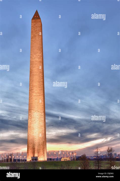 Washington Monument In Dc At Dusk As The Sun Is Setting And Tower Is