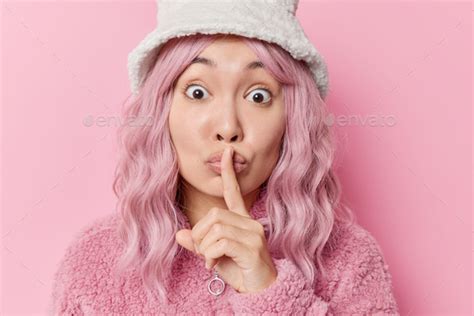 Portrait Of Surprised Mysterious Woman With Long Hair Makes Silence