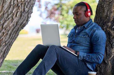 Premium Photo Black Guy Is Preparing For Exams Listening Audio