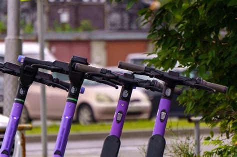 Premium Photo Electric Scooters For The Public Share Standing Outside