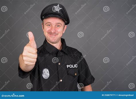 Portrait Of Caucasian Man Wearing Police Uniform Costume And Giving