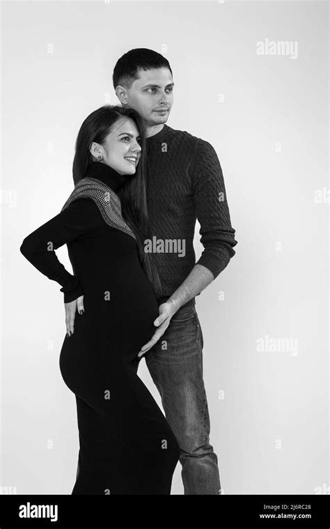 Husband Hugs Pregnant Wife And Touching Belly Stock Photo Alamy