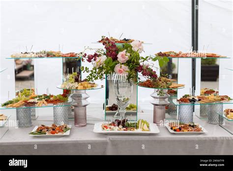A Table Covered With An Array Of Different Types Of Food Ranging From