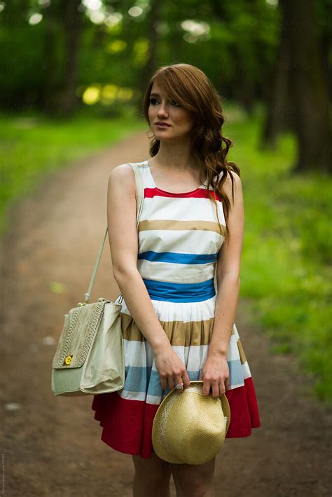 Woman Standing In The Park By Stocksy Contributor Mosuno Stocksy