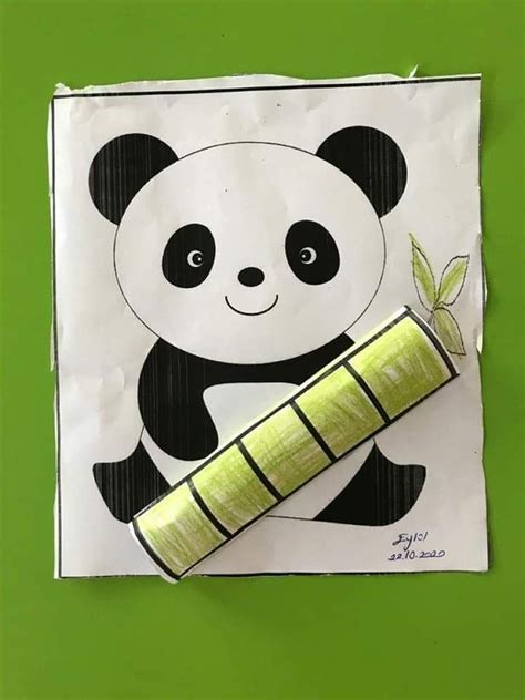 A Piece Of Paper With A Drawing Of A Panda Holding A Bamboo Stick On It