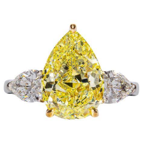 Gia Certified 401 Carat Pear Cut Light Yellow Diamond 3 Stone Ring For
