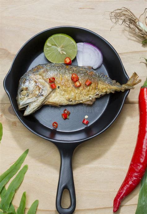 Mackerel Fried In A Frying Pan On A Wooden Table Stock Image Image Of