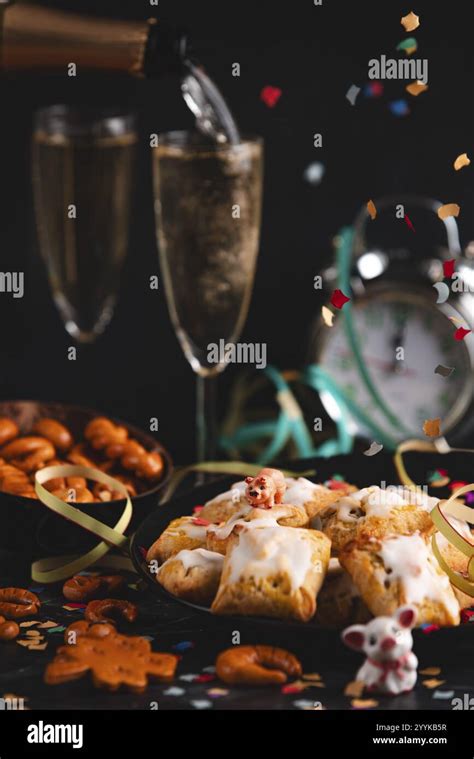 New Years Eve Pastries And Champagne Glasses On A Table Pouring