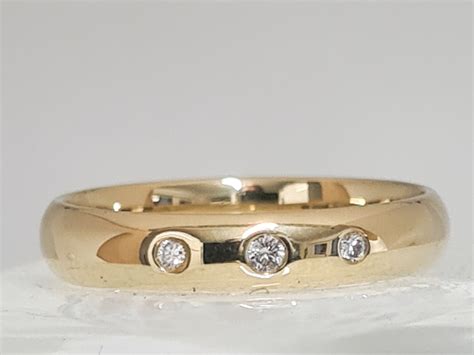 Elegant 18 Karat Court Style Wedding Engagement Ring With Three
