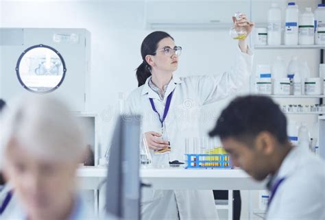 Woman Science Or Chemical In Beaker For Investigation Solution Or Problem Solving In Lab