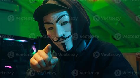 Lviv Ukraine June 03 2024 Hacker Anonymous Typing Computer Looking At Camera Pointing