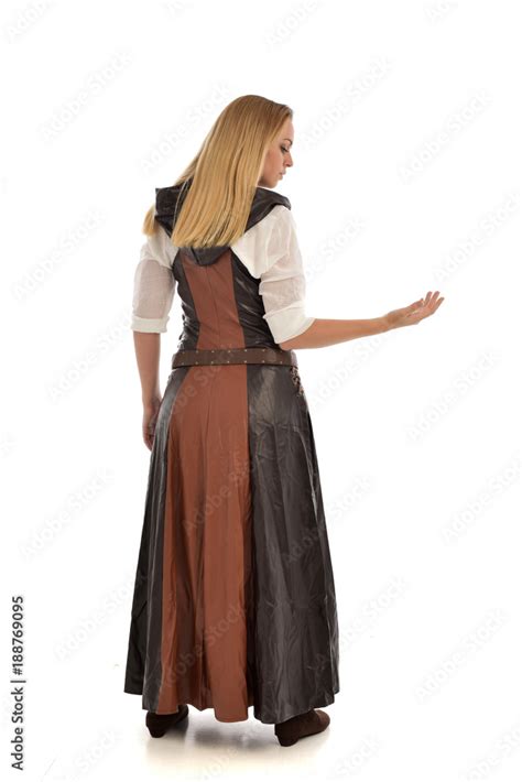 Full Length Portrait Of Girl Wearing Brown Fantasy Costume Standing