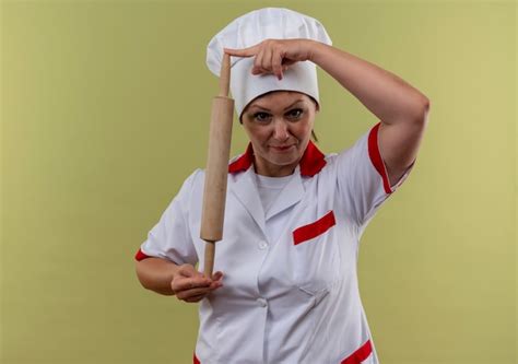 Free Photo Middle Aged Female Cook In Chef Uniform Holding Rolling