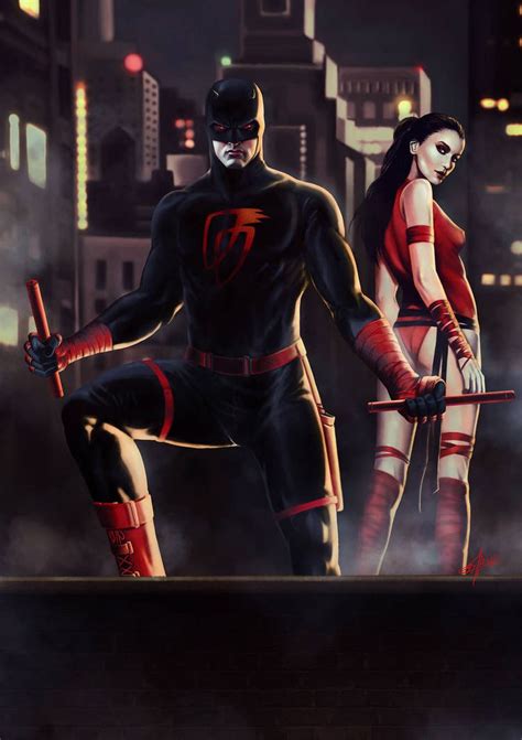 Two People Dressed As Batman And Catwoman Standing On A Rooftop In The