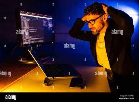 photo of serious professional programmer look camera improving