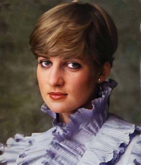 A Close Up Of A Person Wearing A Purple Shirt