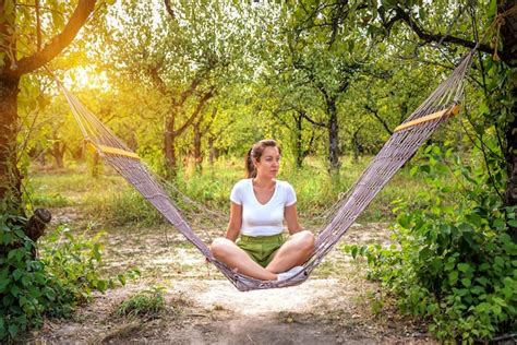 Premium Photo Woman Sittin In Hammok In The Green Garden Orchard