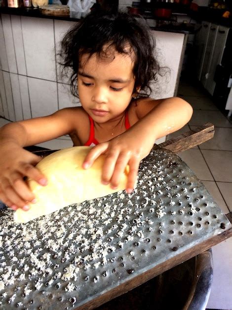 Premium Photo High Angle View Of Cute Girl Grating Cheese