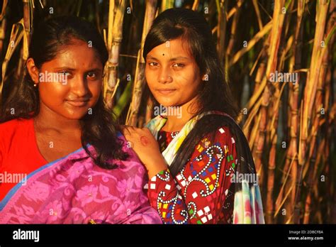 Two Beautiful Teenage Indian Bengali Girls Wearing Sari And Salwar