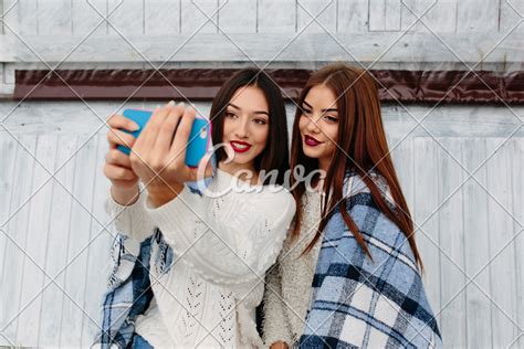 Two Girls Make Selfie Photos By Canva