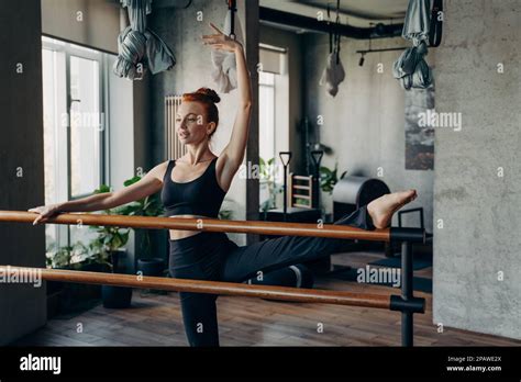 Graceful Young Concentrated Fit Female Ballerina Or Dancer Wearing