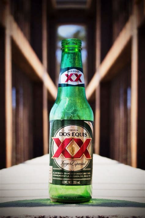 A Bottle Of Beer Sitting On Top Of A Table