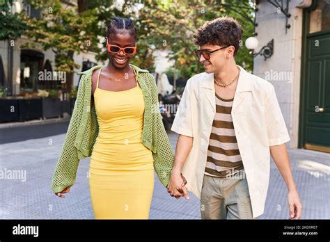 Cheerful Confident Young Multiethnic Couple In Stylish Outfits And