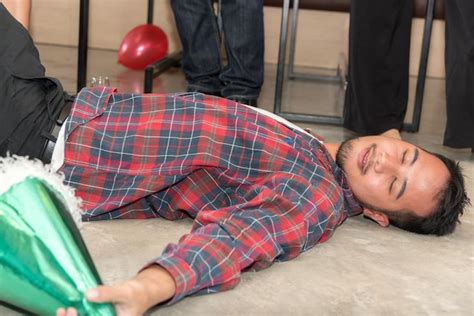 Premium Photo Drunk Man Lying On Floor During Party
